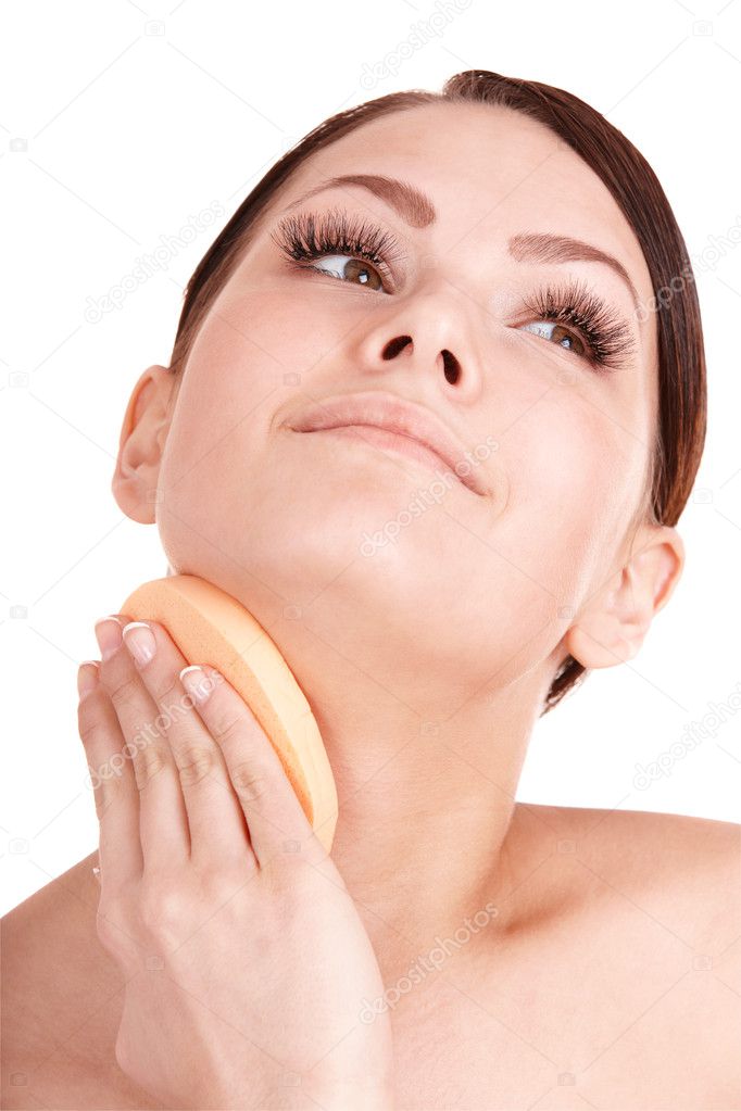 Young woman washing her face by sponge. — Stock Photo © poznyakov #7111527