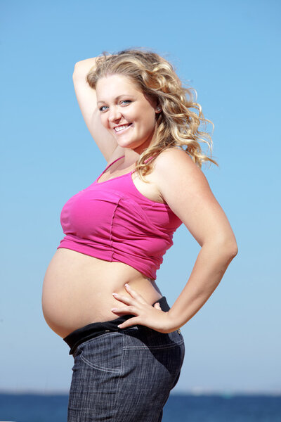 Portrait Of Beautiful Pregnant Woman Over Sea Model Released
