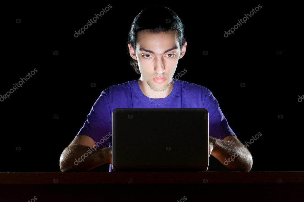 Hacker sitting in dark room Stock Photo by ©Elnur_ 7522235