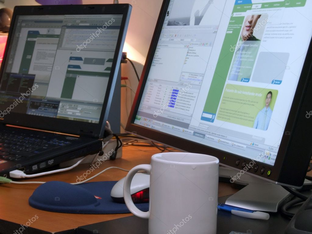 Laptop and big wide screen closeup Stock Photo by ©.shock 7944344