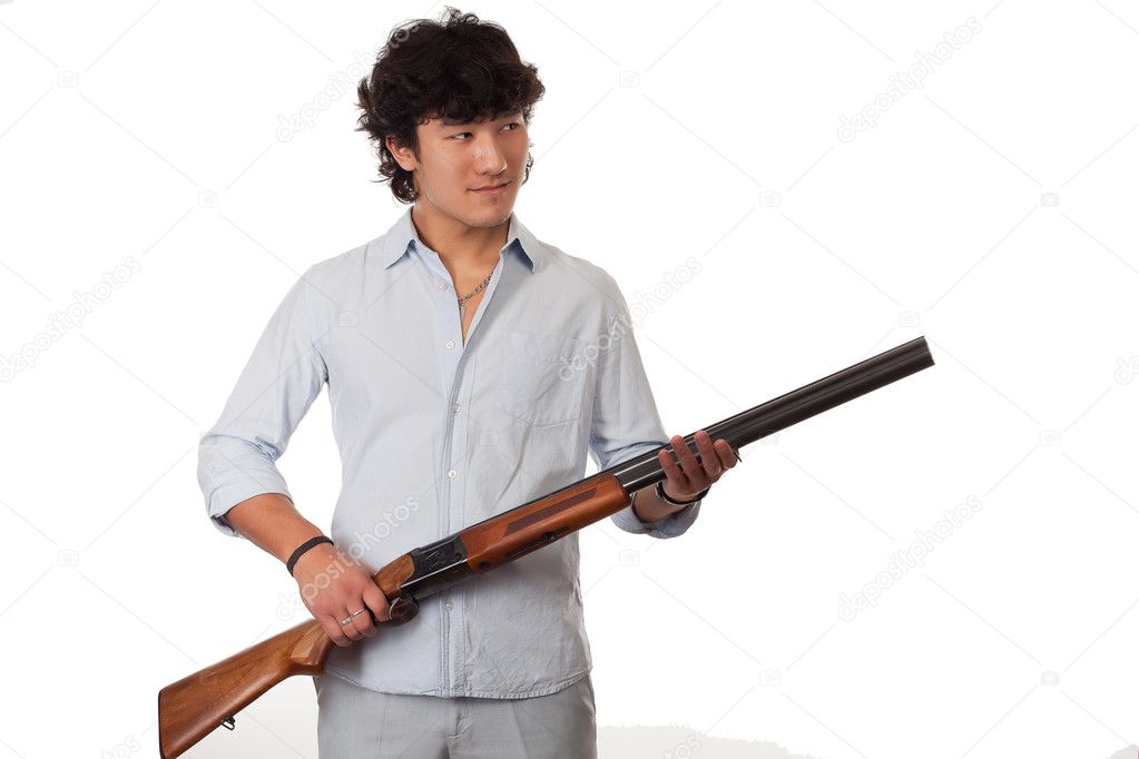 Asian man holding gun on a white bg — Stock Photo © nikola82 #7794642