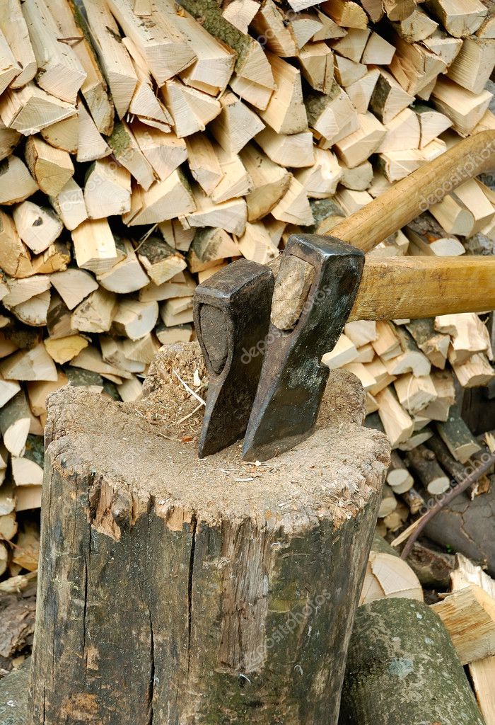 Old splitting axe on the background of woodpile — Stock Photo ...
