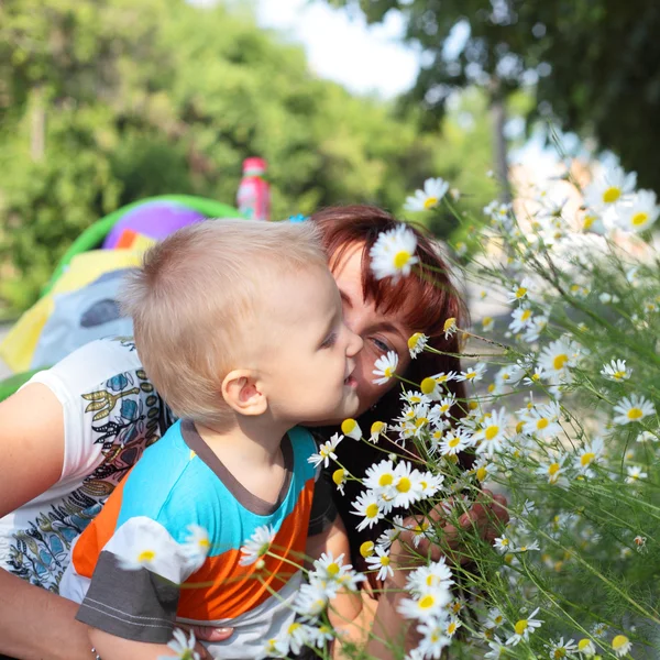 Child smelling flowers Stock Photos, Royalty Free Child smelling ...