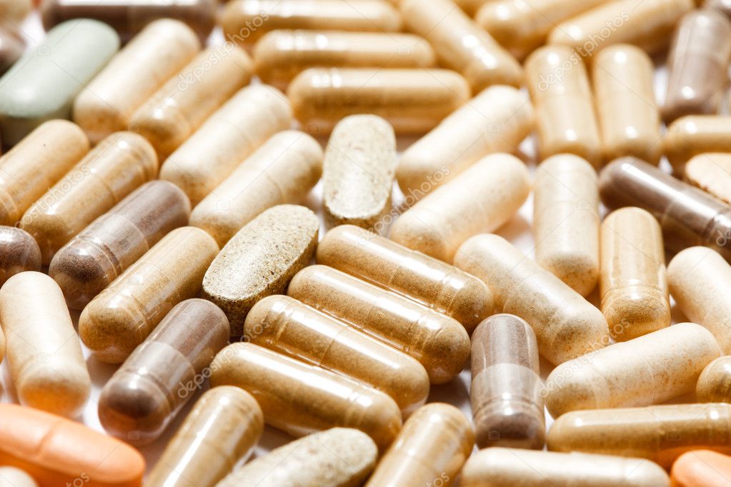 Medicinal pills piled up a bunch Stock Photo by ©apopium 7918968