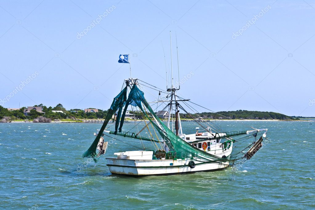 Small fisherboat heading to the ocean catching fish — Stock Photo ...