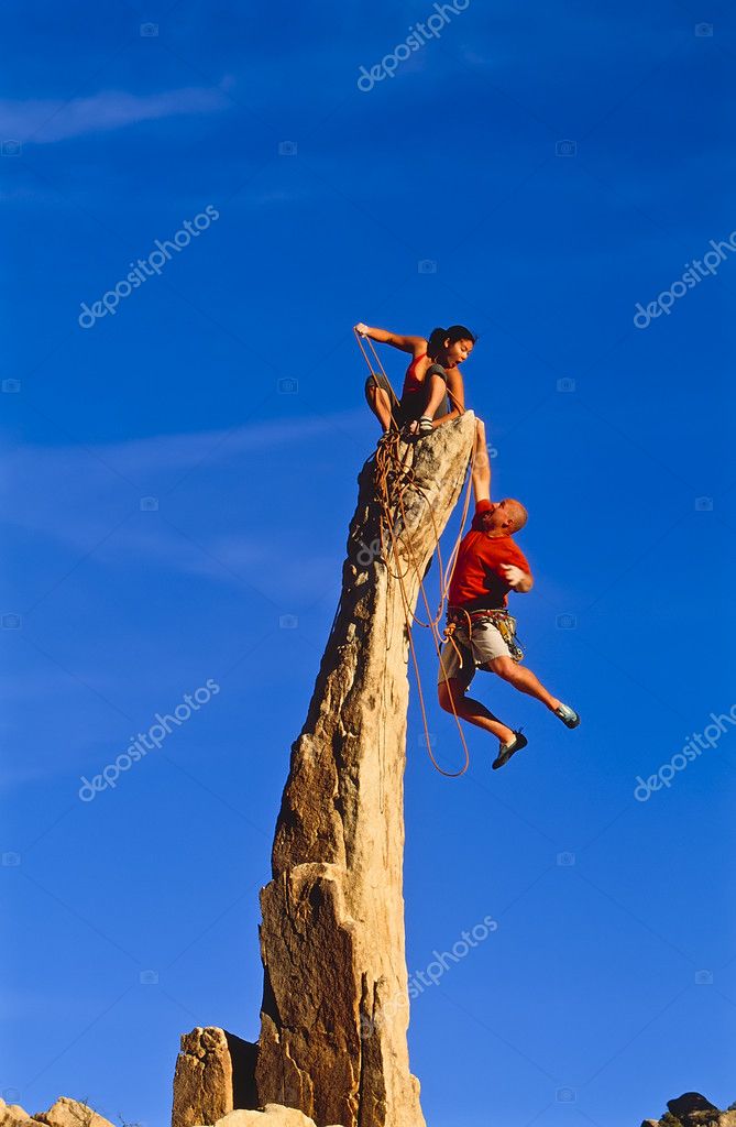 Rock climbing team reaching the summit. — Stock Photo © gregepperson ...