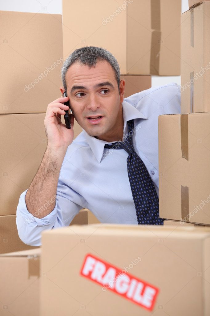 Cellphone user surrounded by boxes — Stock Photo © photography33 #7376763