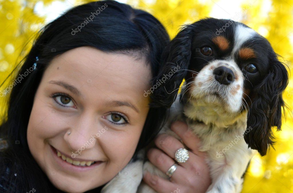 Girl with dog in spring — Stock Photo © muro #7221830